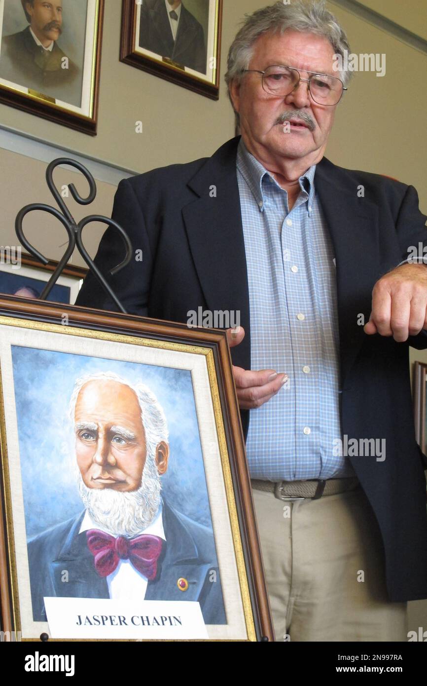 Artist Burdette Calkins shows his oil painting of Jasper Chapin, the ...