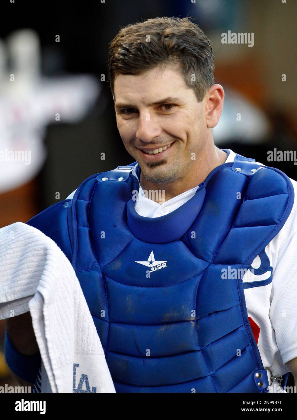 Los Angeles Dodgers catcher Matt Treanor smiles in the dugout before a ...