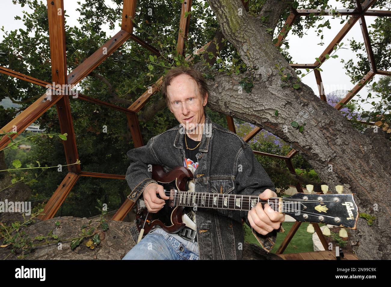 Robby Krieger poses for a portrait in his custom built treehouse built ...