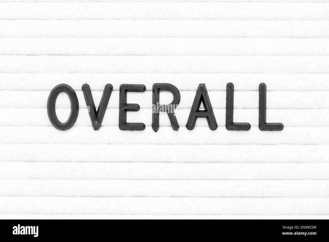 Black color letter in word overall on white felt board background Stock ...