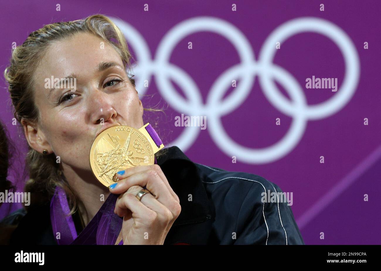 United States' Kerri Walsh Jennings kisses her medal during a podium ...