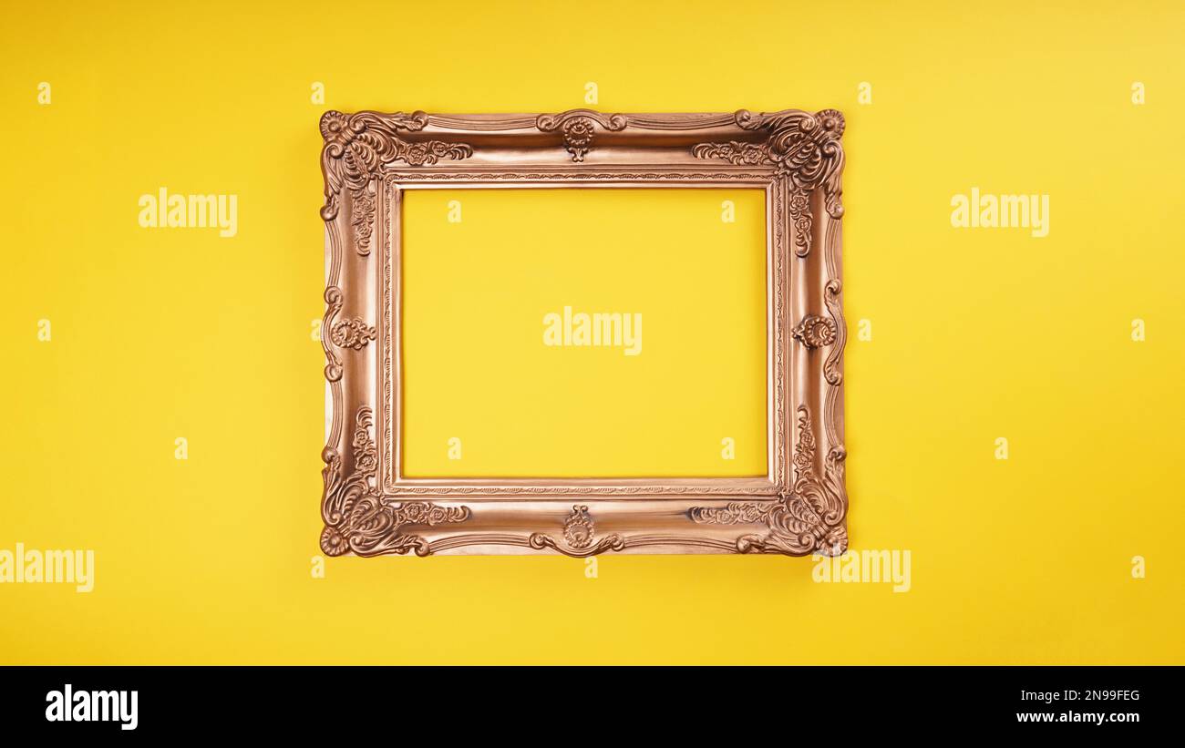 Gold frame on yellow wall hi-res stock photography and images - Alamy