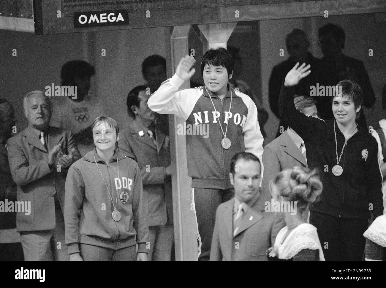 On the podium at the medal awarding ceremony of the Women's 100 meter ...