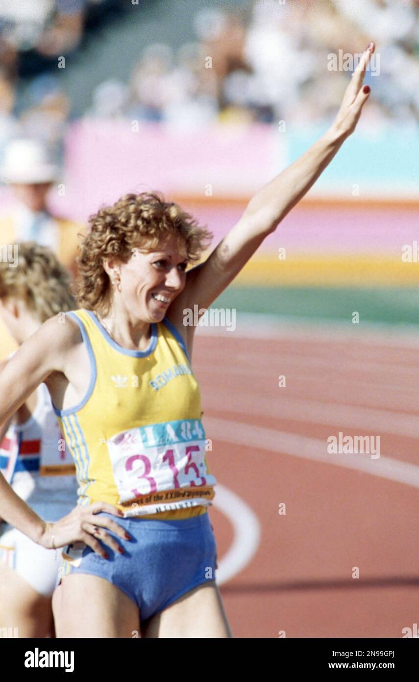 Romania's Doina Melinte holds her arm up after winning the Women's 800 ...