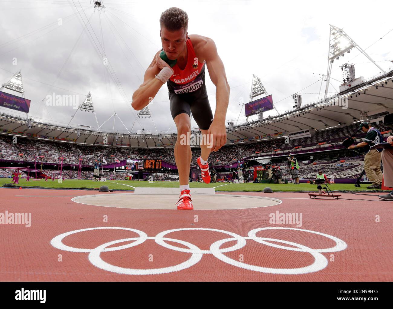 Germany's Pascal Behrenbruch prepares for his throw in the shot put in ...