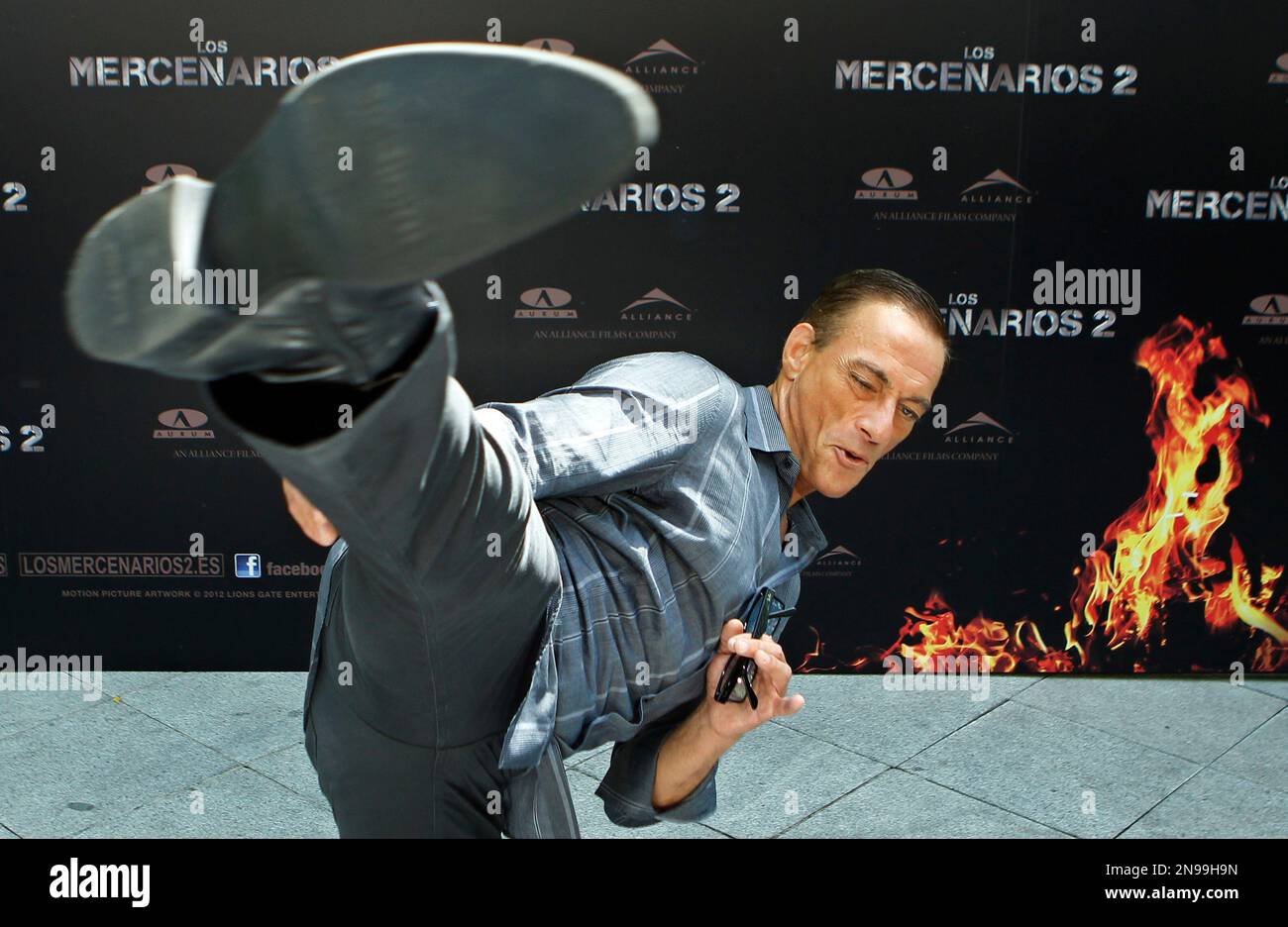 Belgian actor Jean-Claude Van Damme makes a martial art kick during a ...
