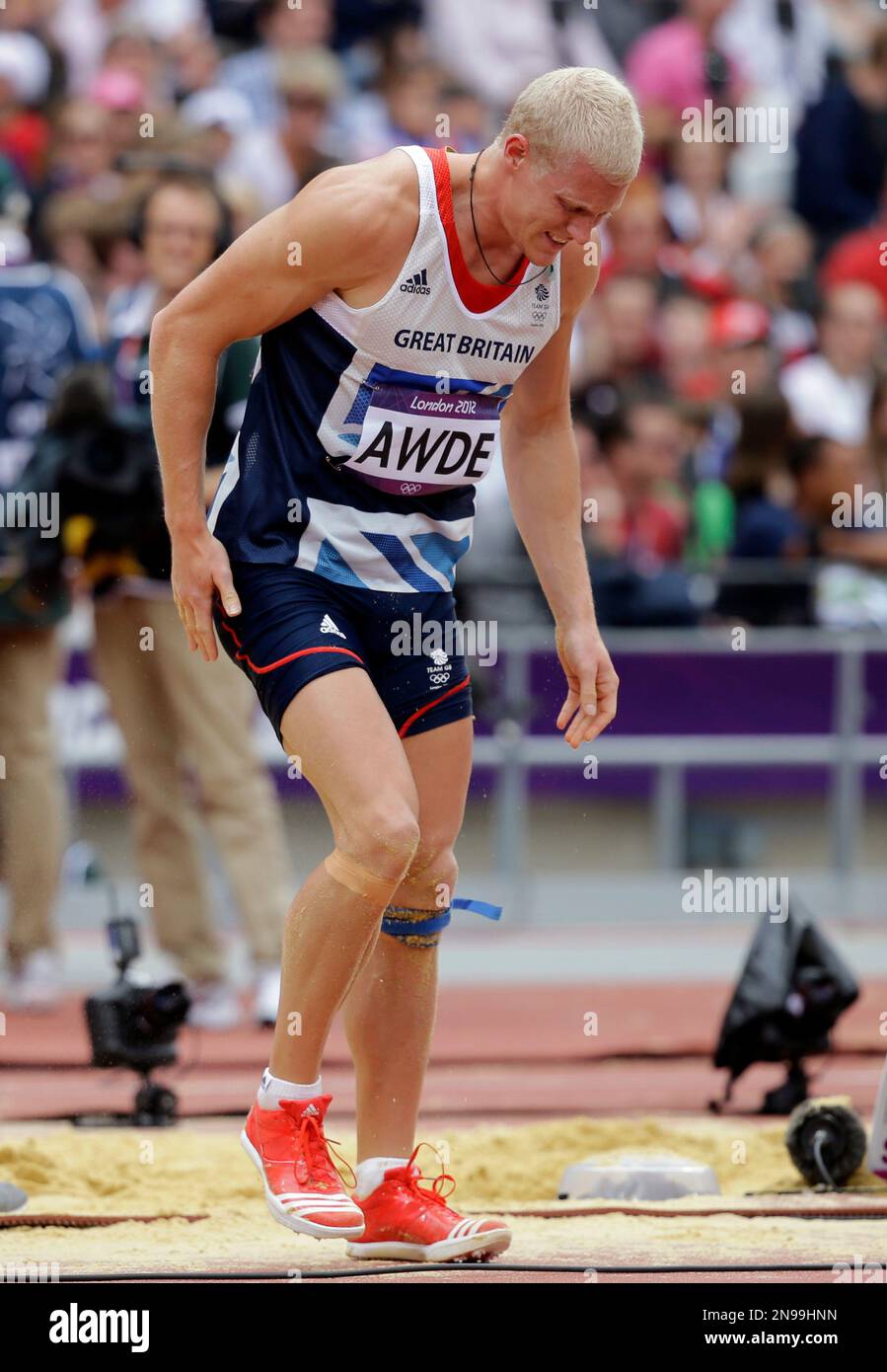 Britain's Daniel Awde reacts after taking a jump in a long jump ...