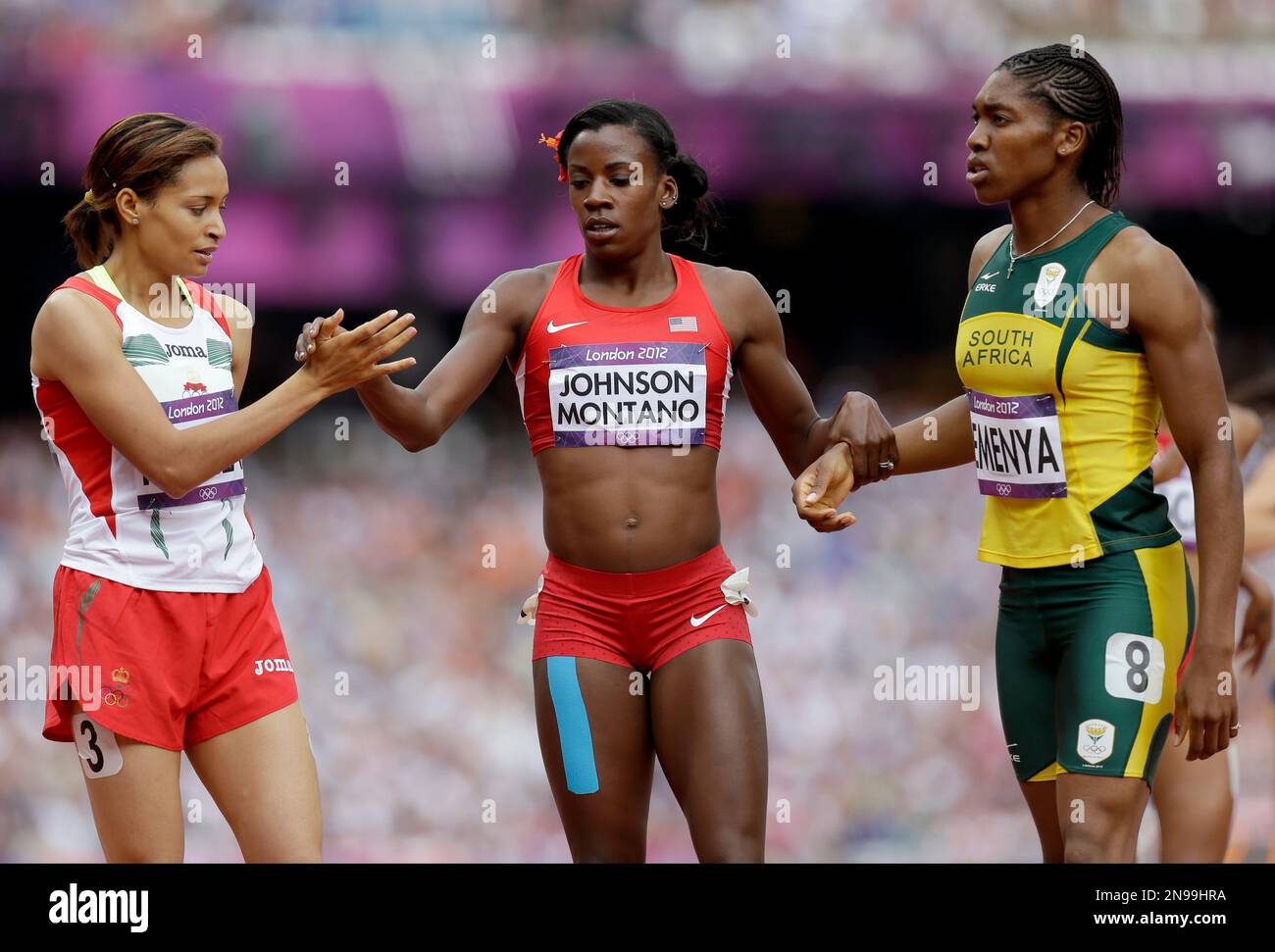 United States' Alysia Johnson Montano, center, shakes hands with ...