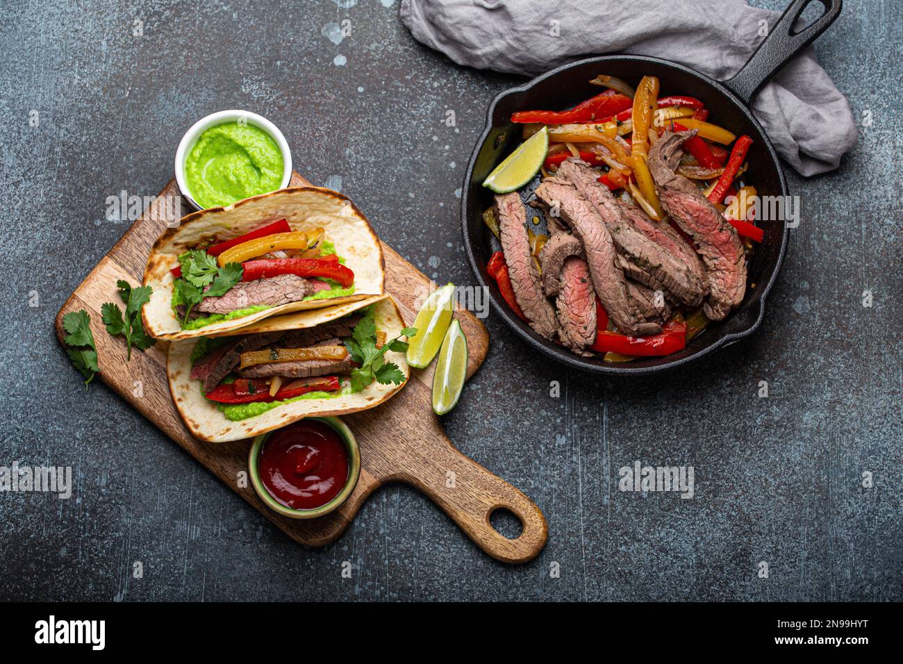 Process of making traditional Mexican dish Beef fajitas tacos served on ...