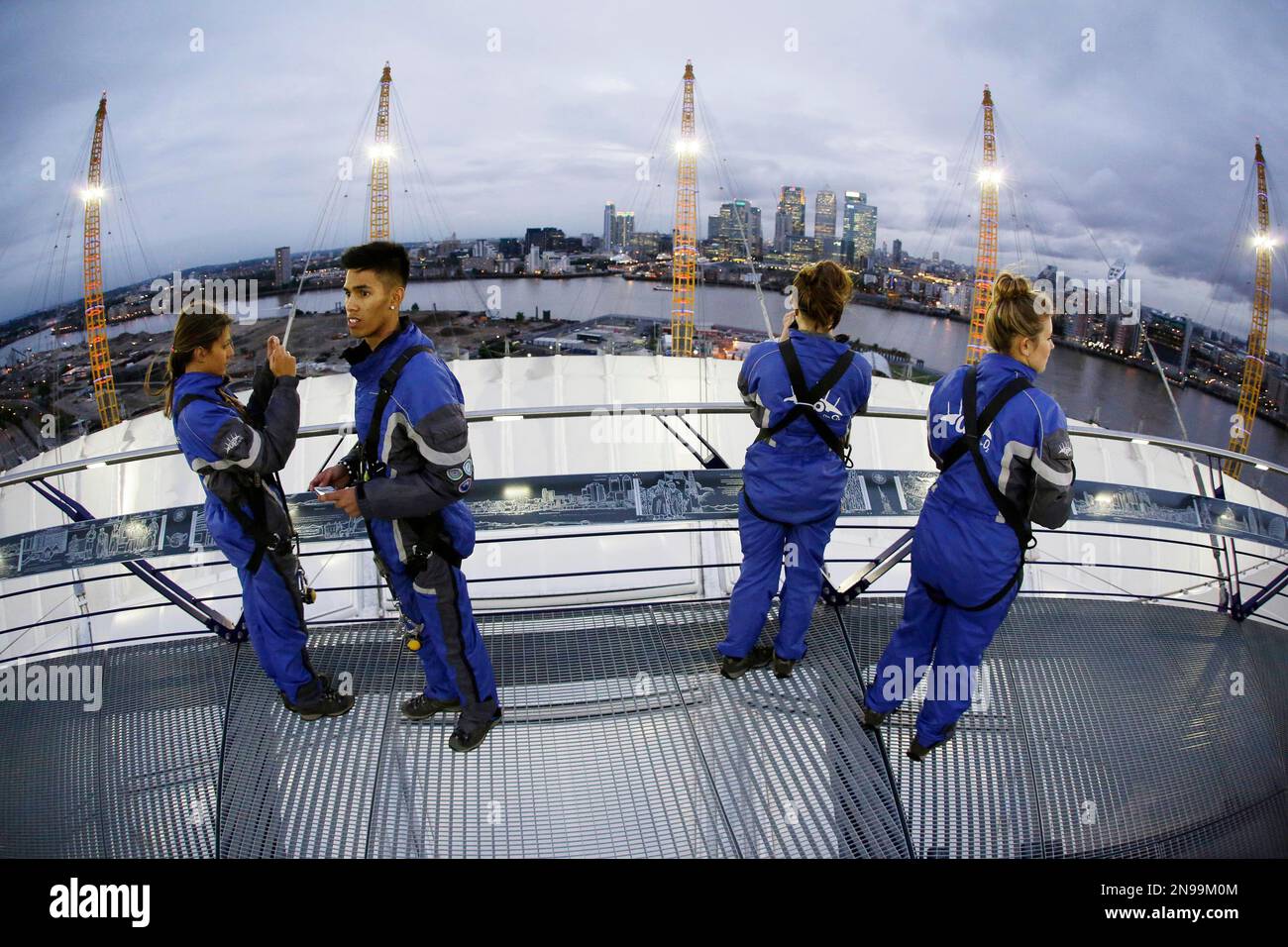 Tourists take in the view of central London from atop the North ...