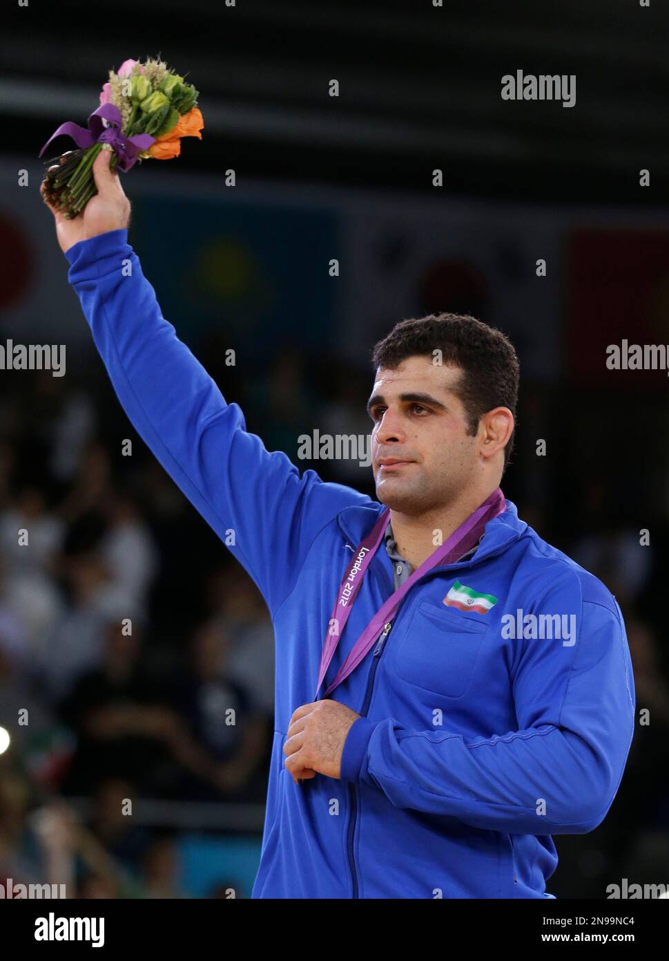 Iran's Ghasem Gholamreza Rezaei reacts on the victory stand after ...