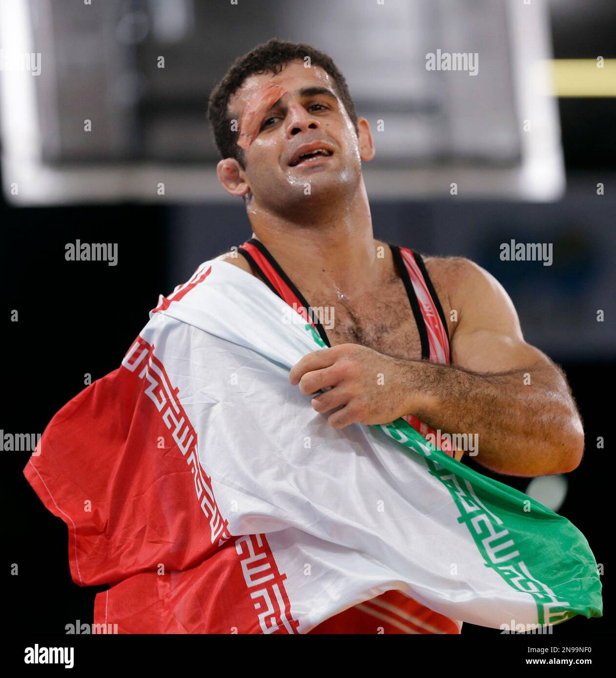 Iran's Ghasem Gholamreza Rezaei celebrates after defeating Russia's ...