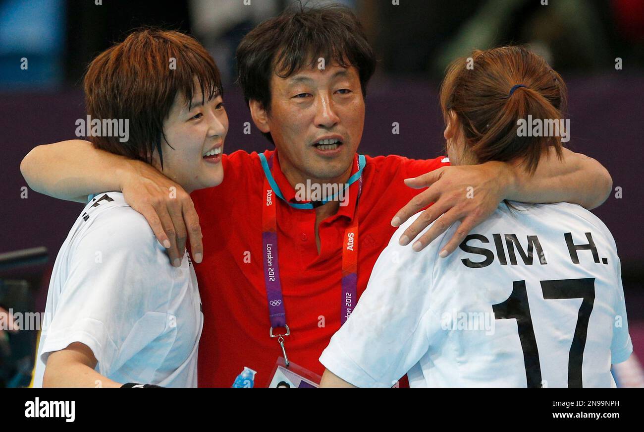 South Korea's coach Kang Jae-won, center, celebrates with players Ryu ...