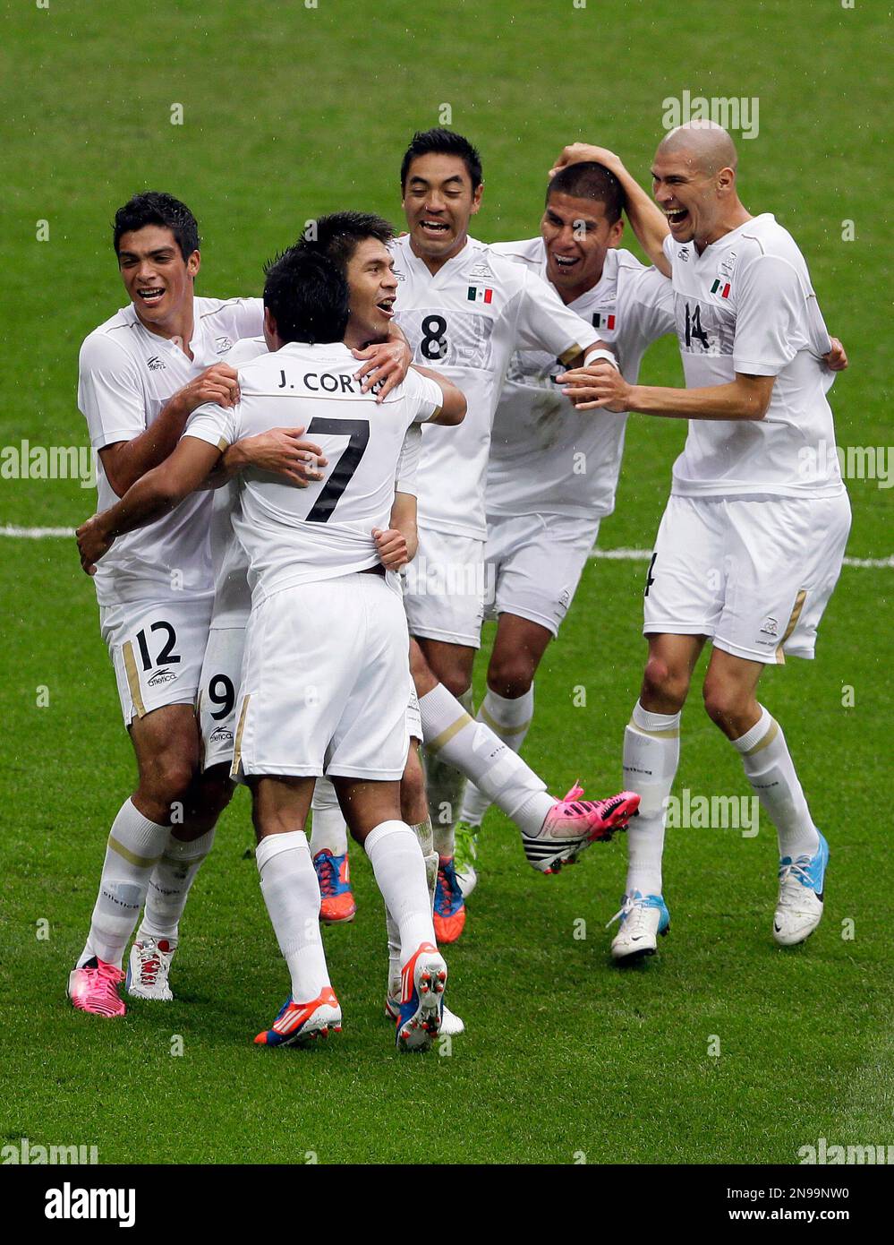 Mexico's Javier Cortes, (7) is hugged by his teammates after scoring ...