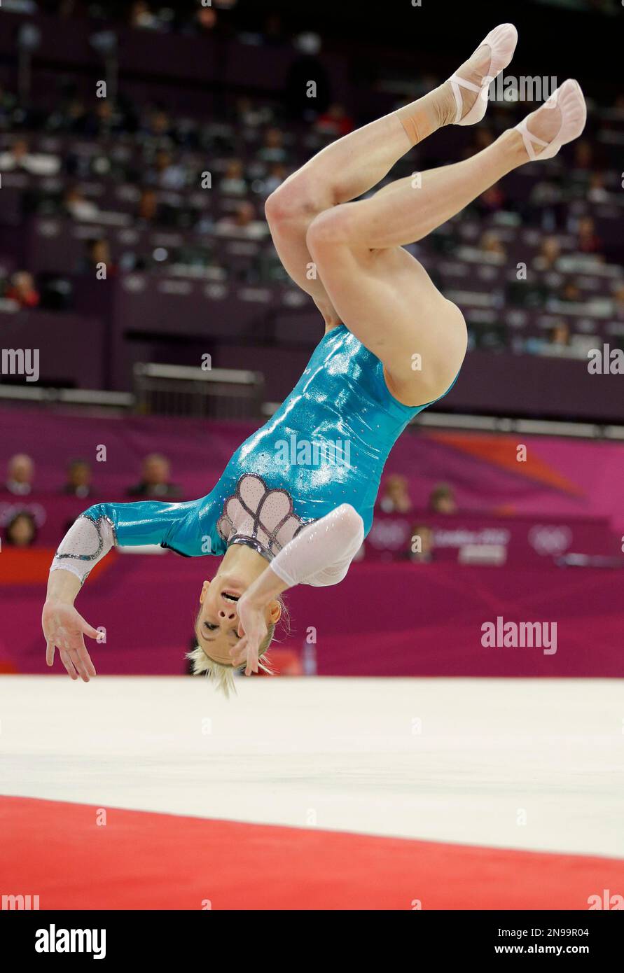 Romania's gymnast Sandra Raluca Izbasa loses her balance before landing ...