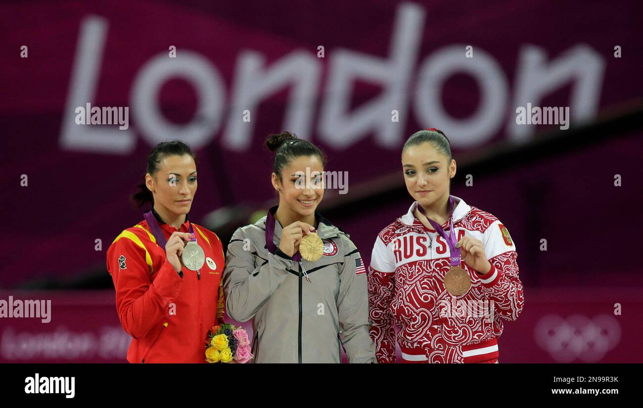 U.S. gold medallist gymnast Alexandra Raisman, center, Romania's silver ...
