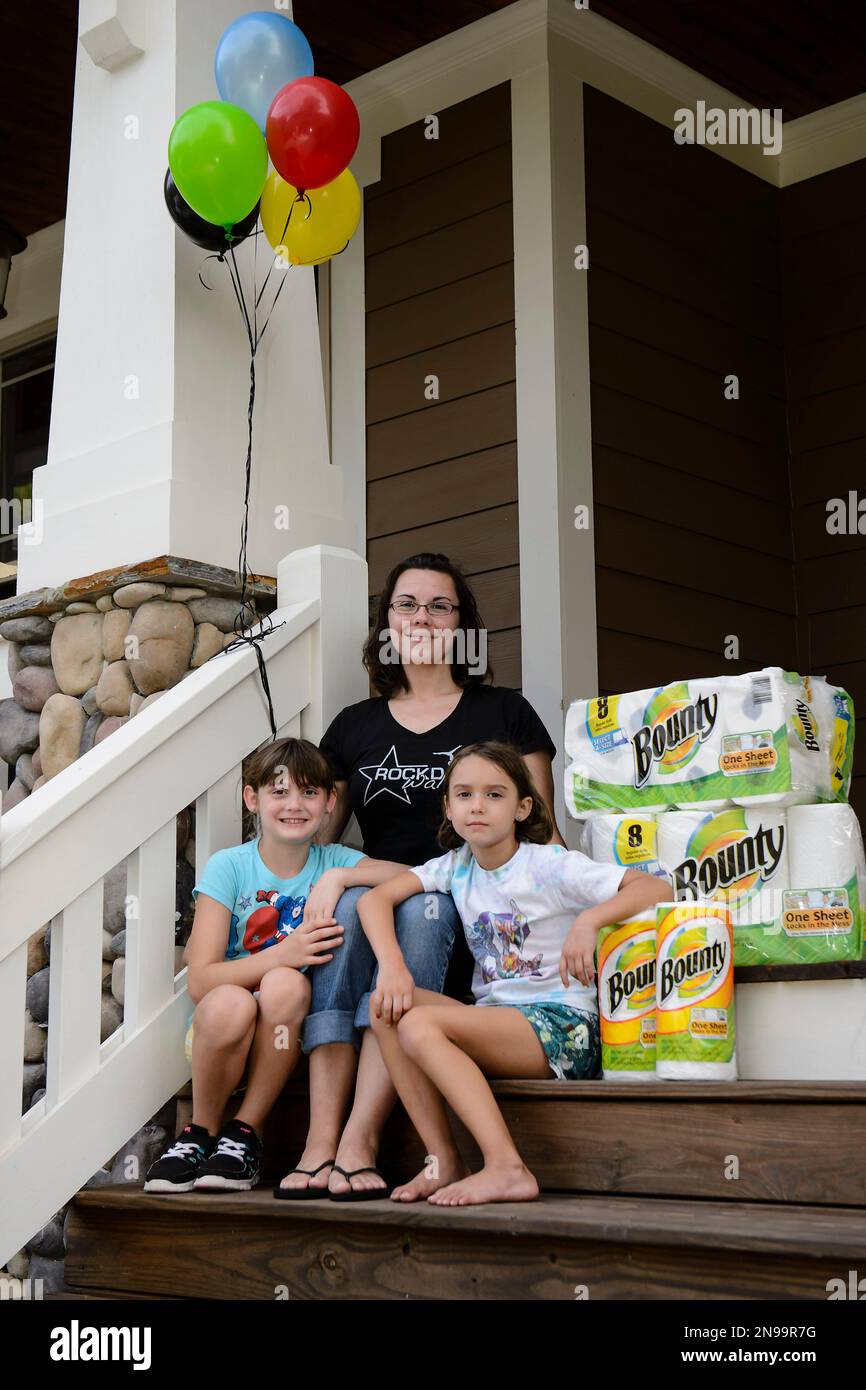 Megan Sims and her daughters, Delaney (left) and Cidella, pose for a ...