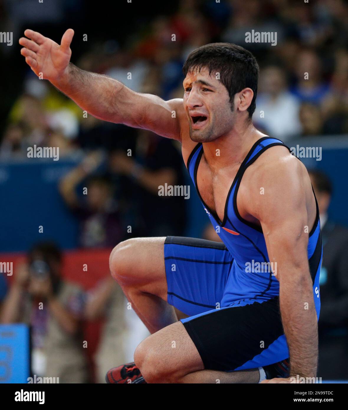 Iran's Saeid Morad Abdvali reacts during his match against France's ...