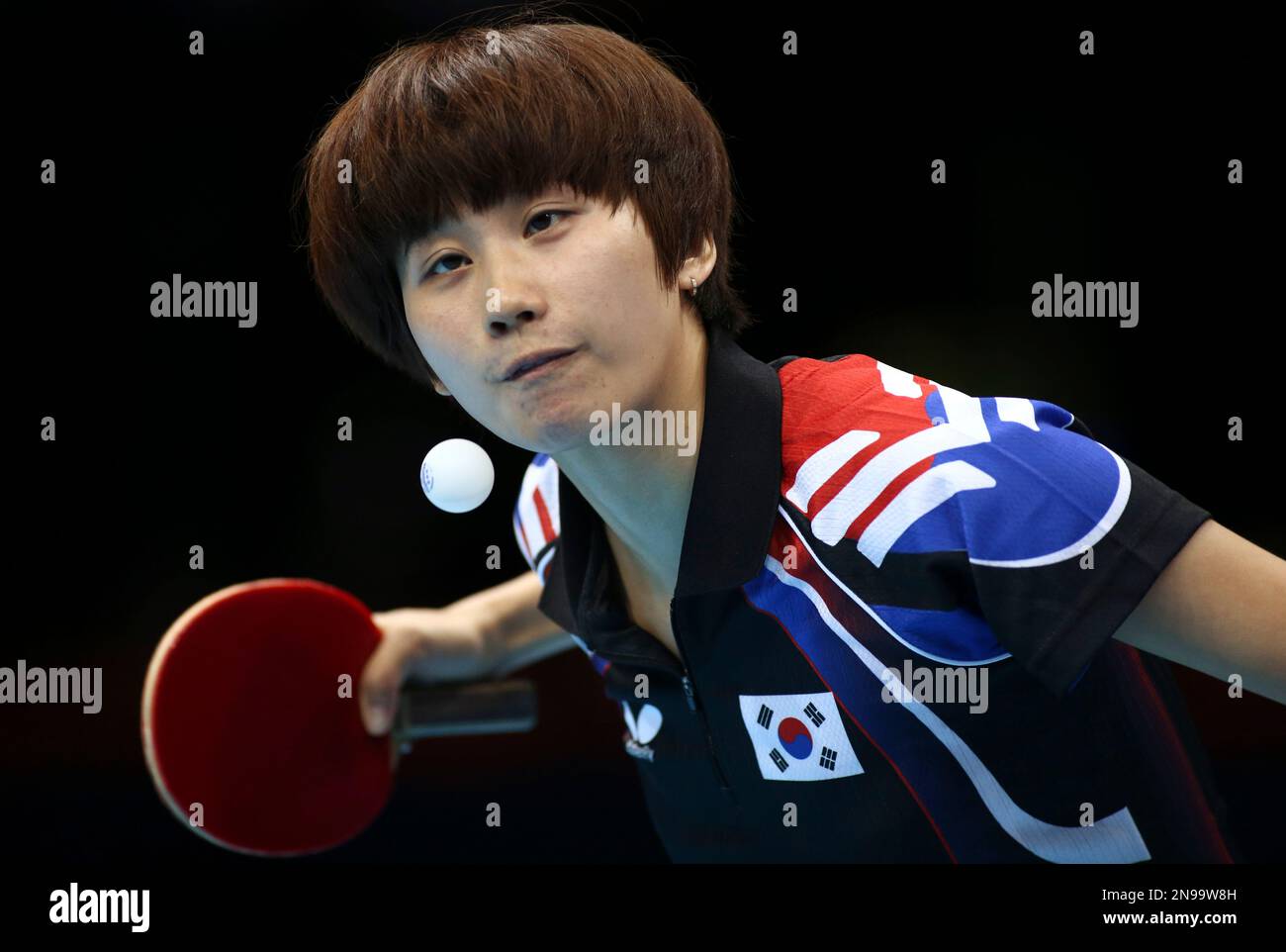 South Korea's Seok Ha-jung serves to Singapore's Li Jiawei in a women's ...