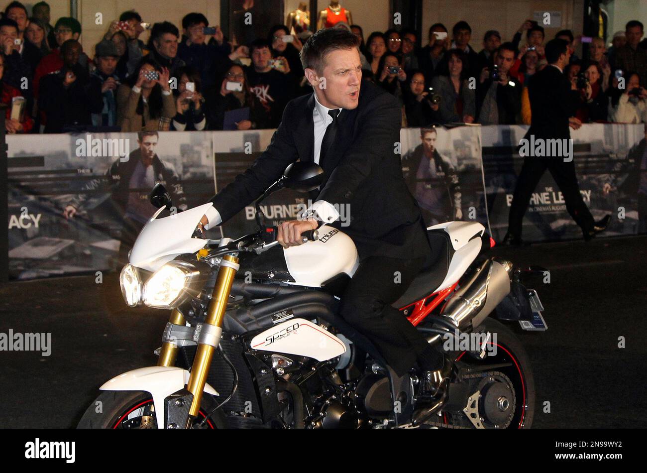 Actor Jeremy Renner arrives on a motorcycle for the premiere of "The ...