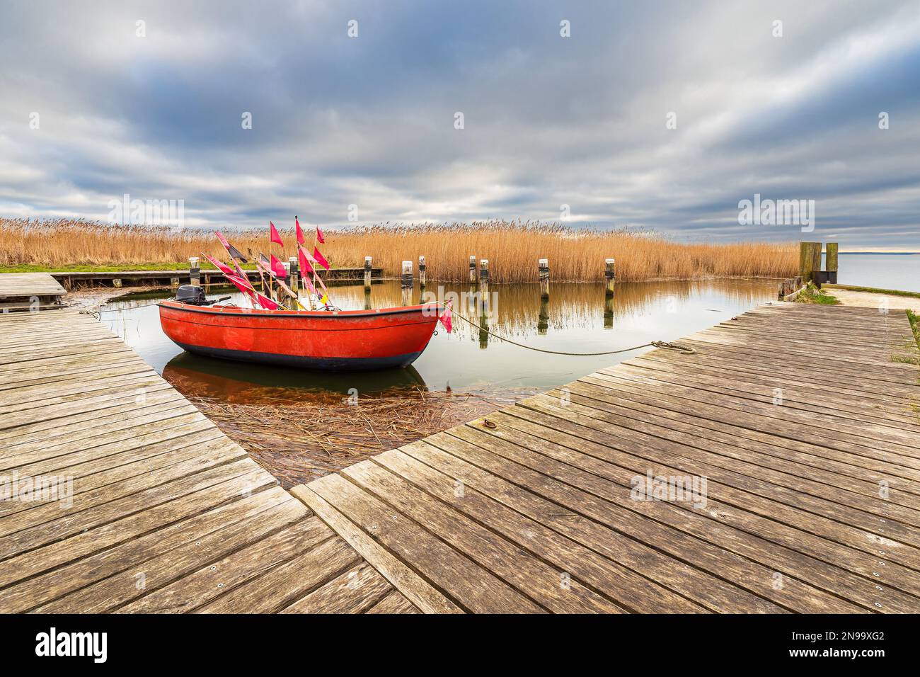 Red fishing boat in the port of Althagen, Germany Stock Photo - Alamy