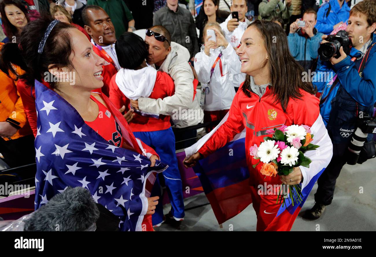 United States' Jennifer Suhr, left, speaks with Russia's Yelena ...