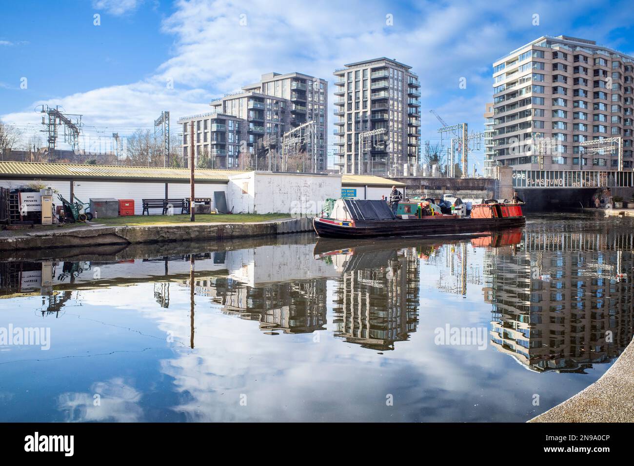 St Pancras Basin, Regents Canal, London: a supply barges approaches St ...