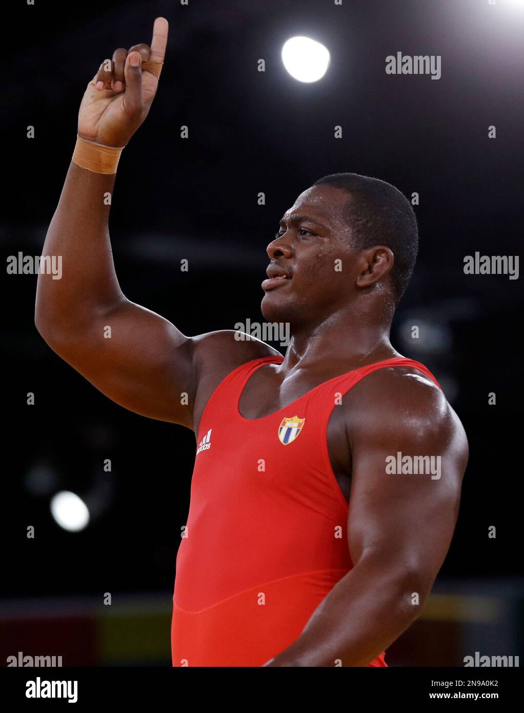 Mijain Lopez Nunez of Cuba reacts after beating Heiki Nabi of Estonia ...