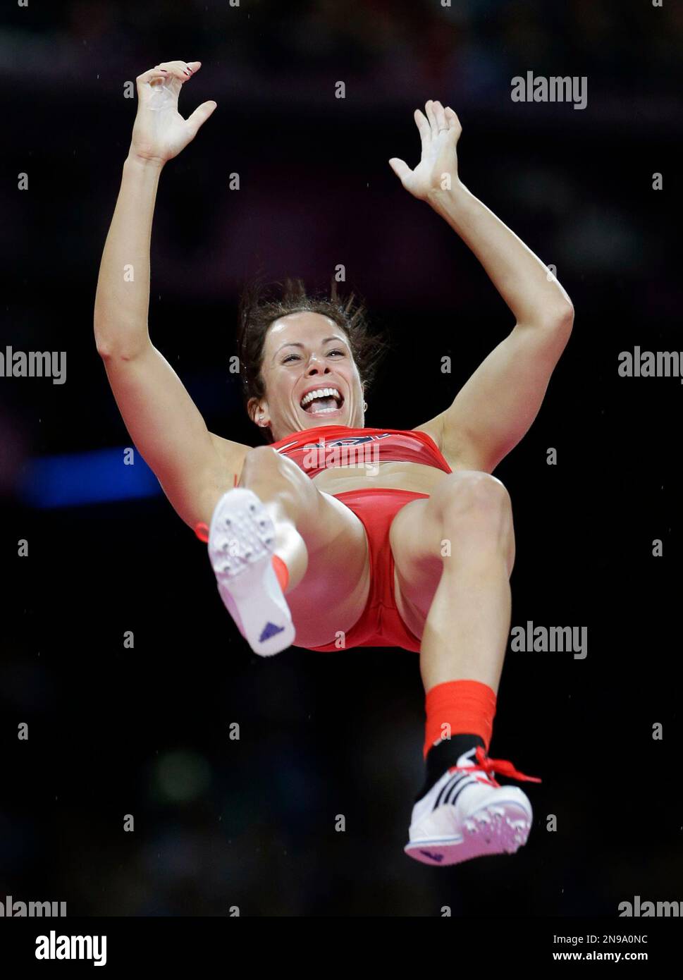 United States' Jennifer Suhr reacts as she clears the bar in the women ...
