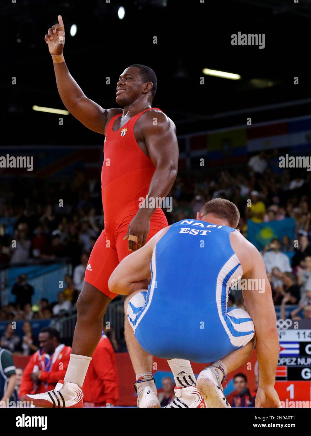 Mijain Lopez Nunez of Cuba reacts after beating Heiki Nabi of Estonia ...