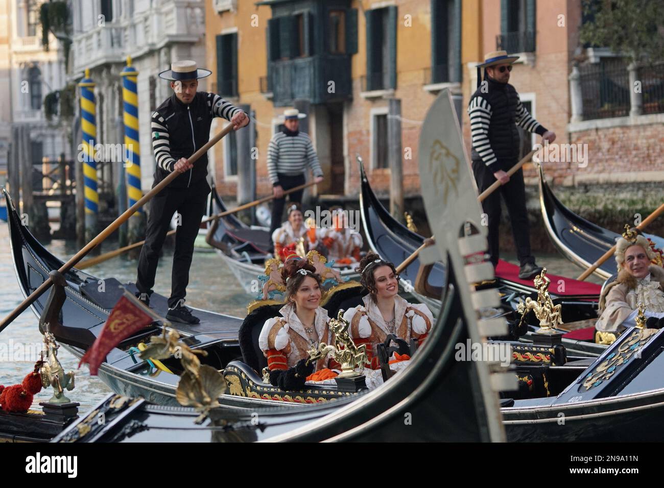 Venice, Italy. 11th Feb, 2023. Two young Venetian women, dressed in the ...