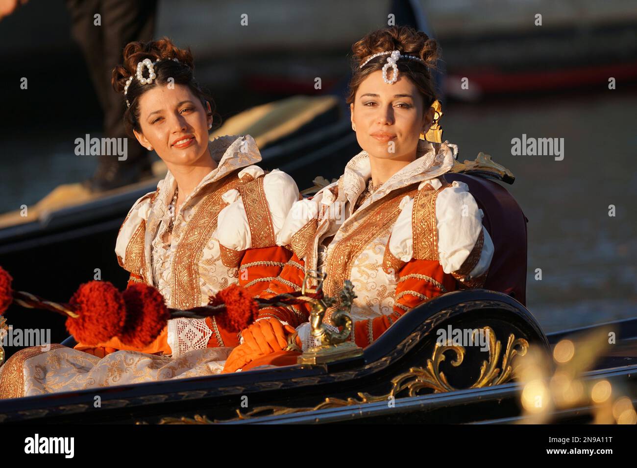 Venice, Italy. 11th Feb, 2023. Two young Venetian women, dressed in the ...