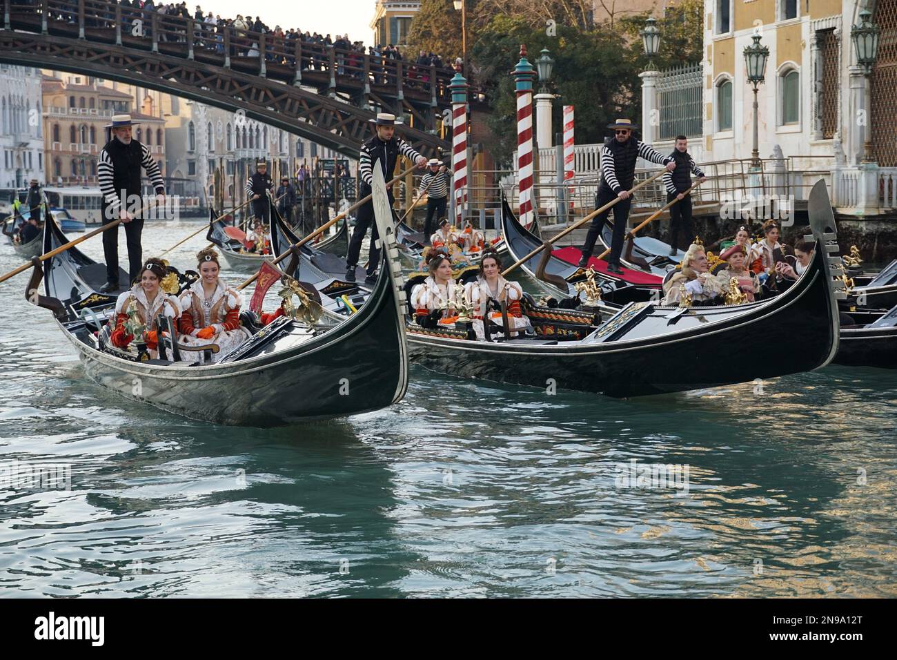Venice, Italy. 11th Feb, 2023. Four young Venetian women, dressed in ...