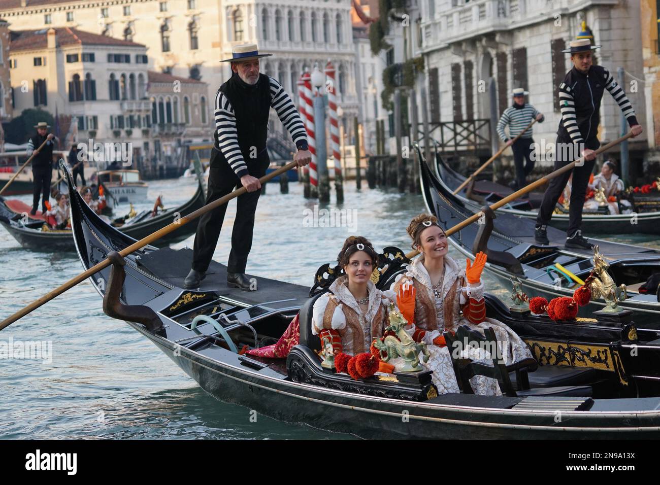 Venice, Italy. 11th Feb, 2023. Two young Venetian women, dressed in the ...