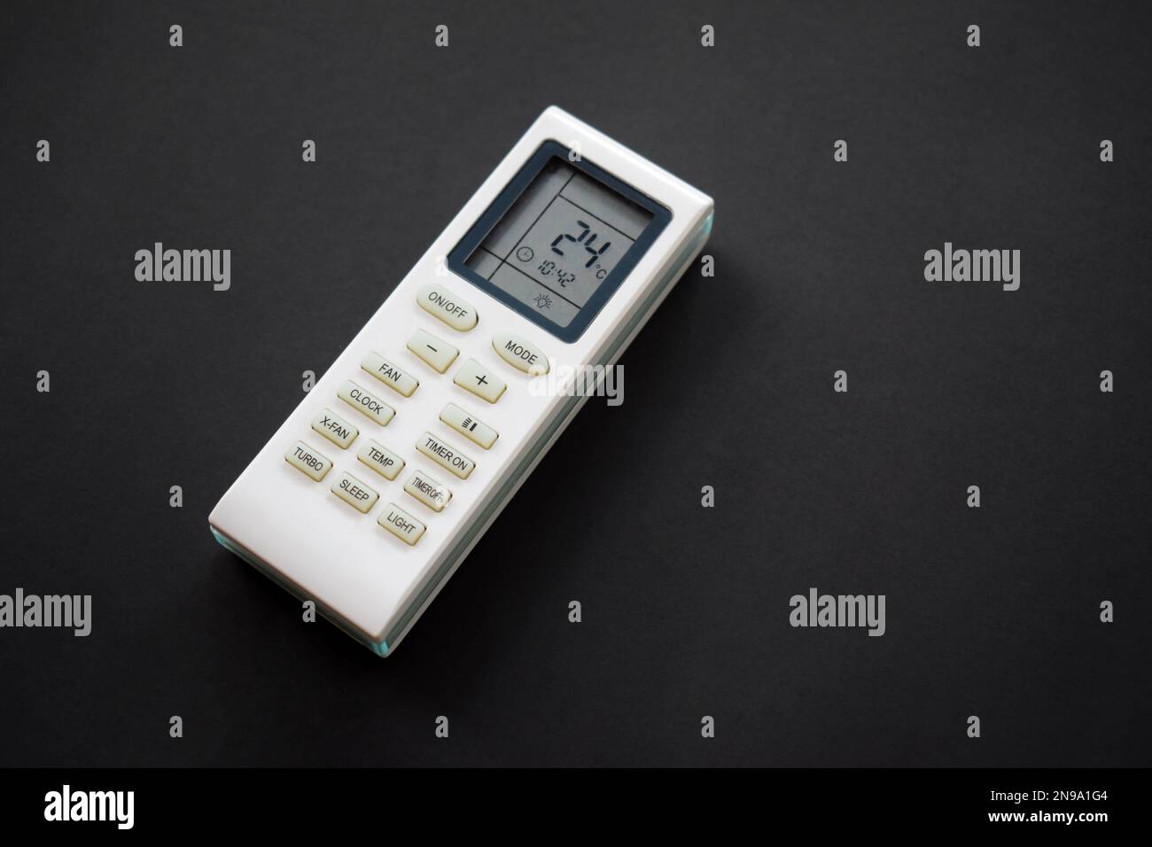 Air conditioner remote on black background. Close up air conditioner 24 ...