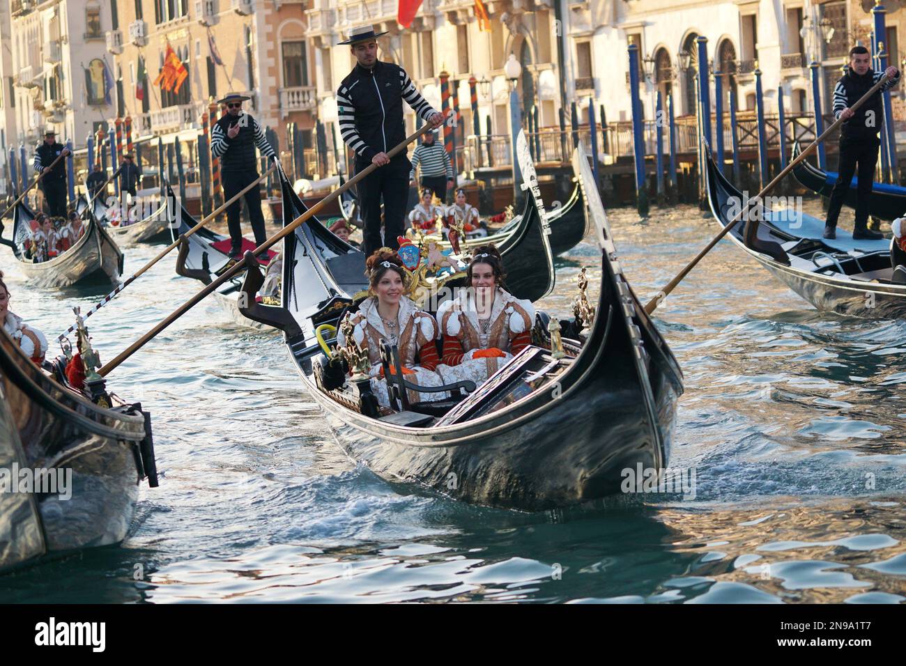 Venice, Italy. 11th Feb, 2023. Two young Venetian women, dressed in the ...