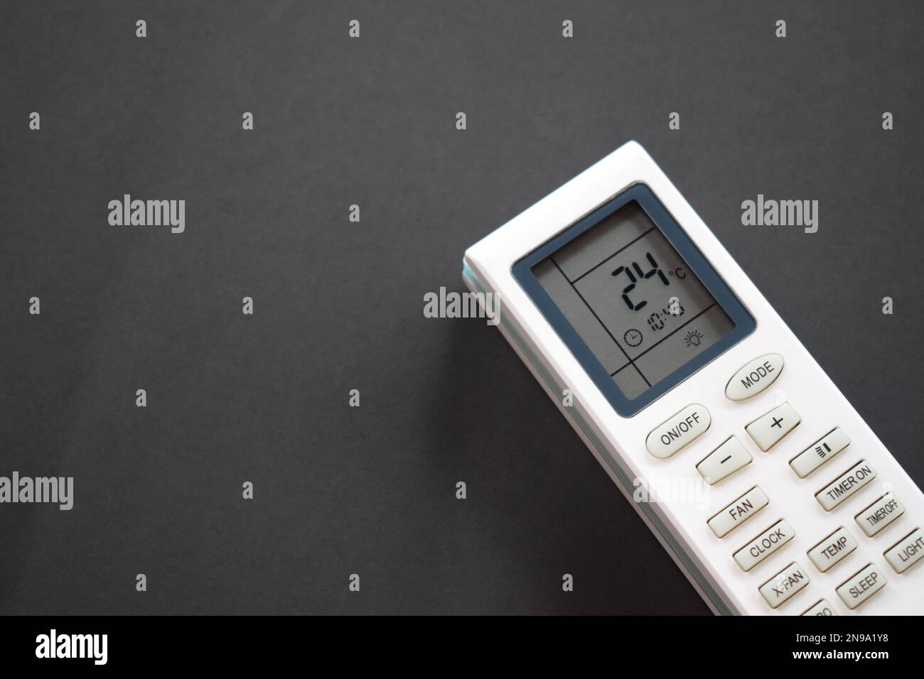 Air conditioner remote on black background. Close up air conditioner 24 ...