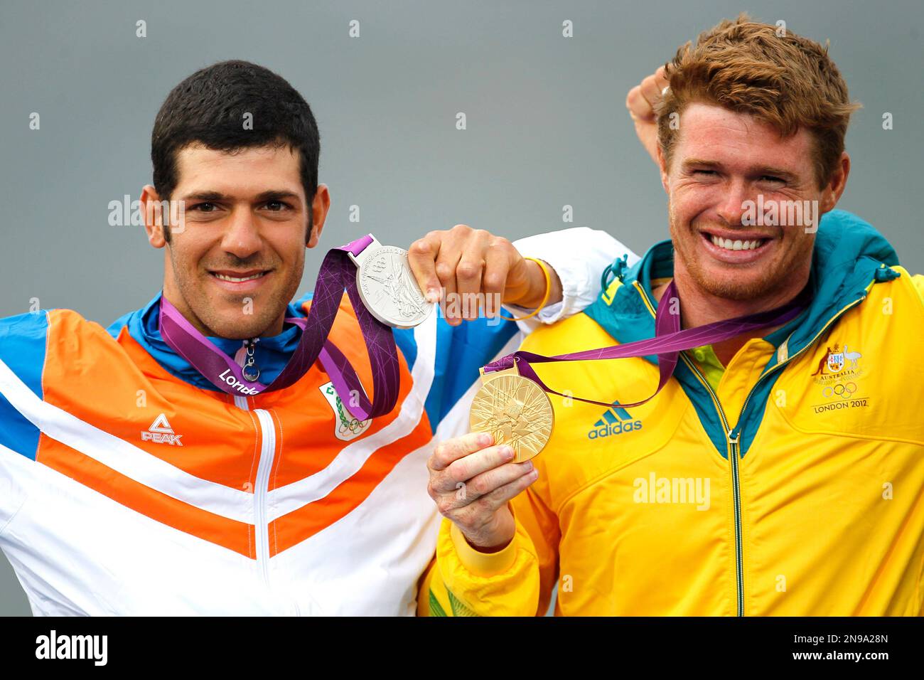 Gold medal Australia's Tom Slingsby, right, and silver medal's Pavlos ...
