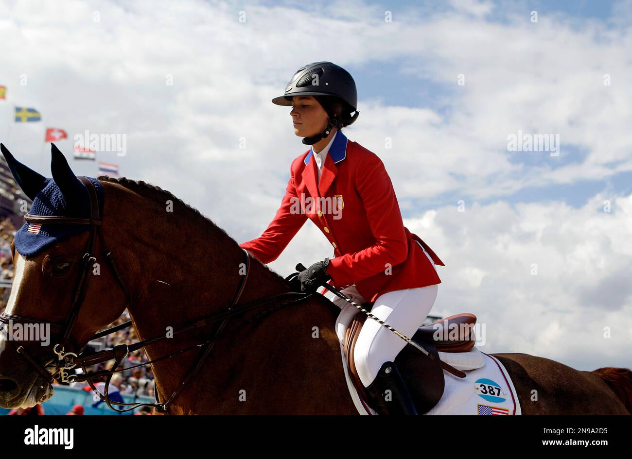 Reed Kessler, of the United States, rides her horse Cylana, out of the ...