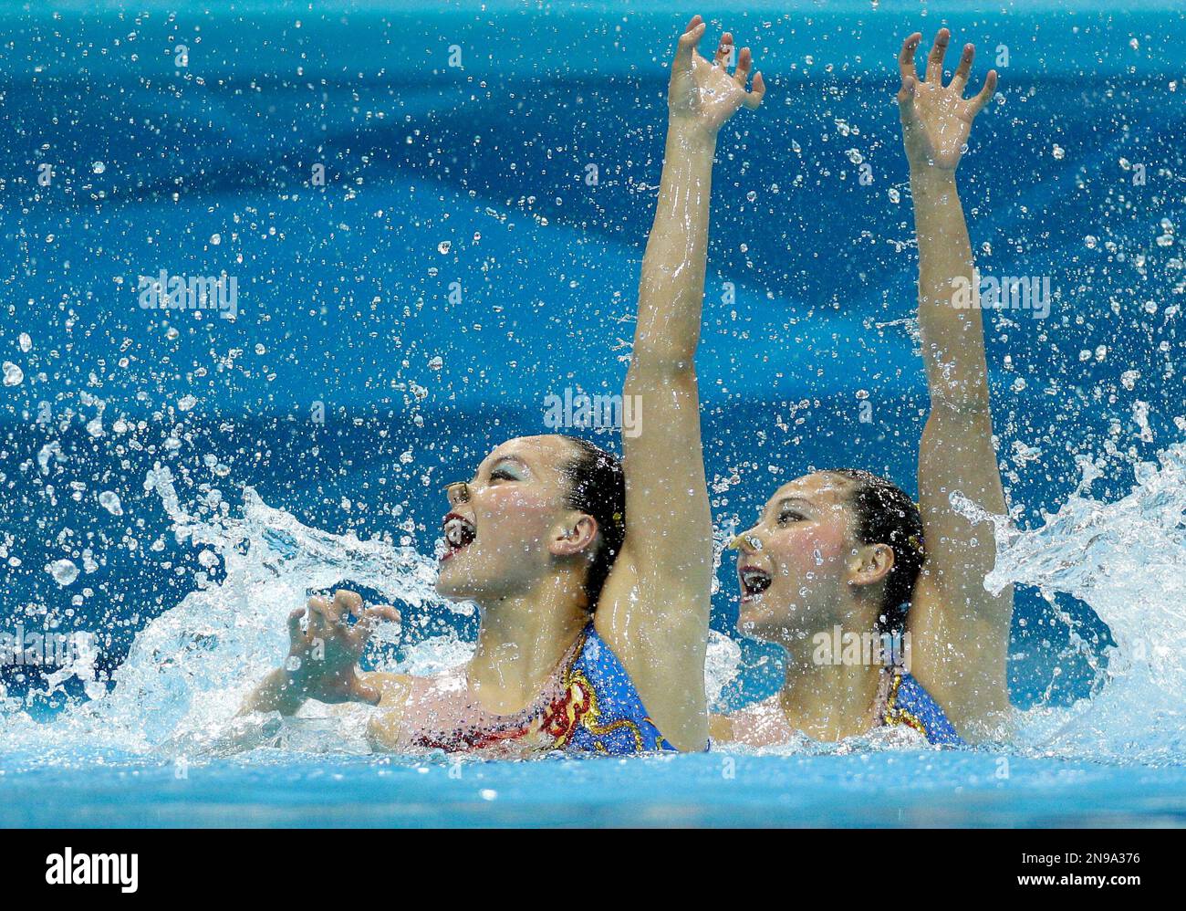 Huang Xuechen and Liu Ou from China compete during the women's duet ...