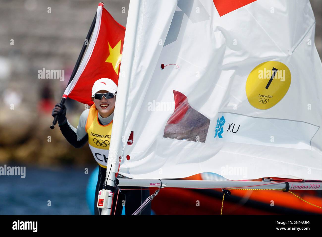 Xu Lijia of China celebrates her gold medal during the Laser radial ...