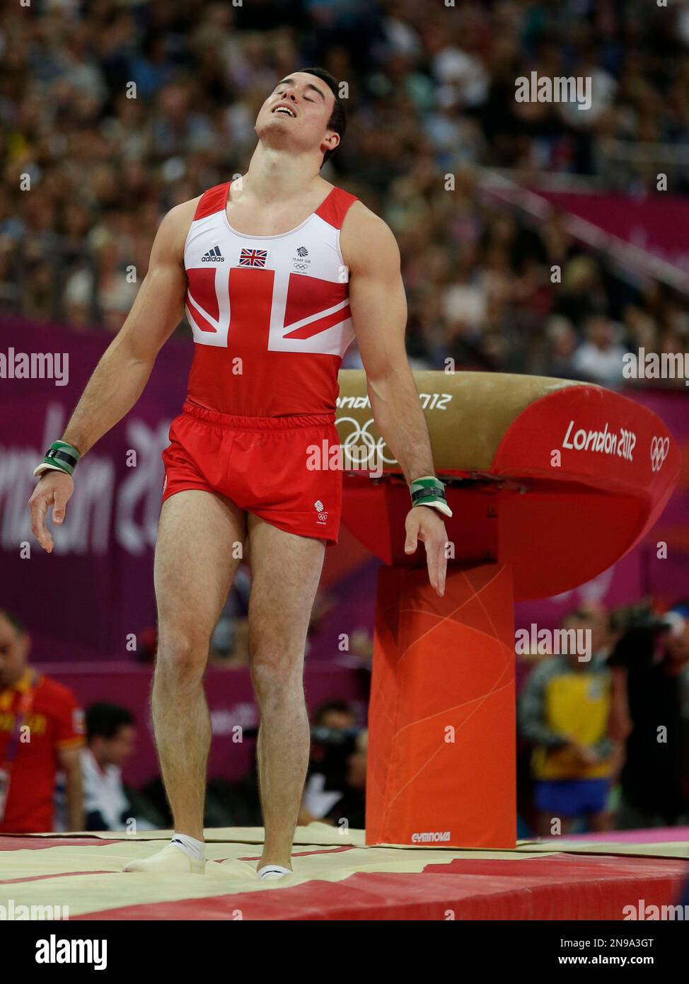Britain's gymnast Kristian Thomas reacts after botching his dismount ...