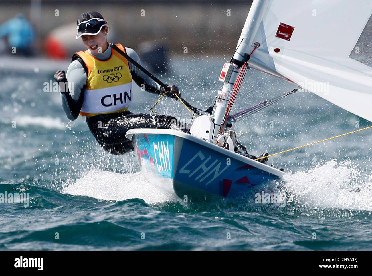 Xu Lijia of China reacts to win the gold medal during the Laser radial ...