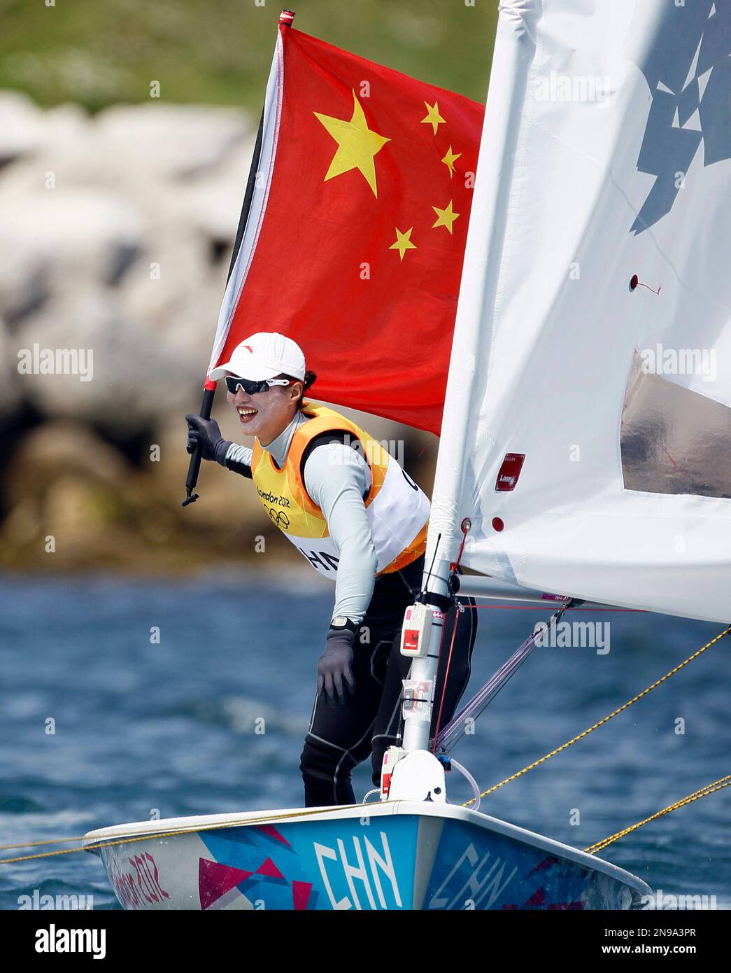 Xu Lijia of China celebrates her gold medal during the Laser radial ...