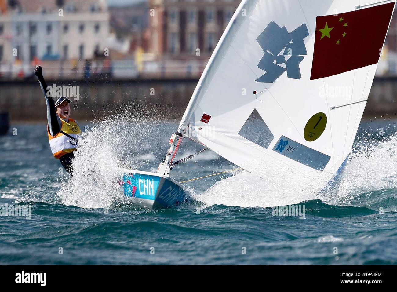 Xu Lijia of China reacts to win the gold medal during the Laser radial ...