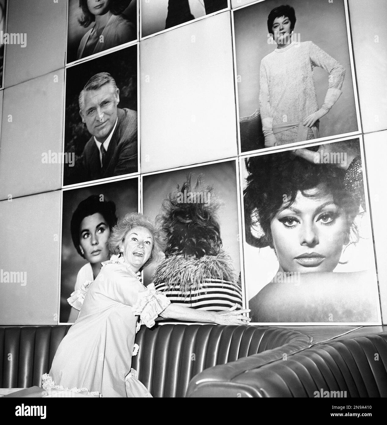 Phyllis Diller (front view) stands in front of her photo on June 23 ...