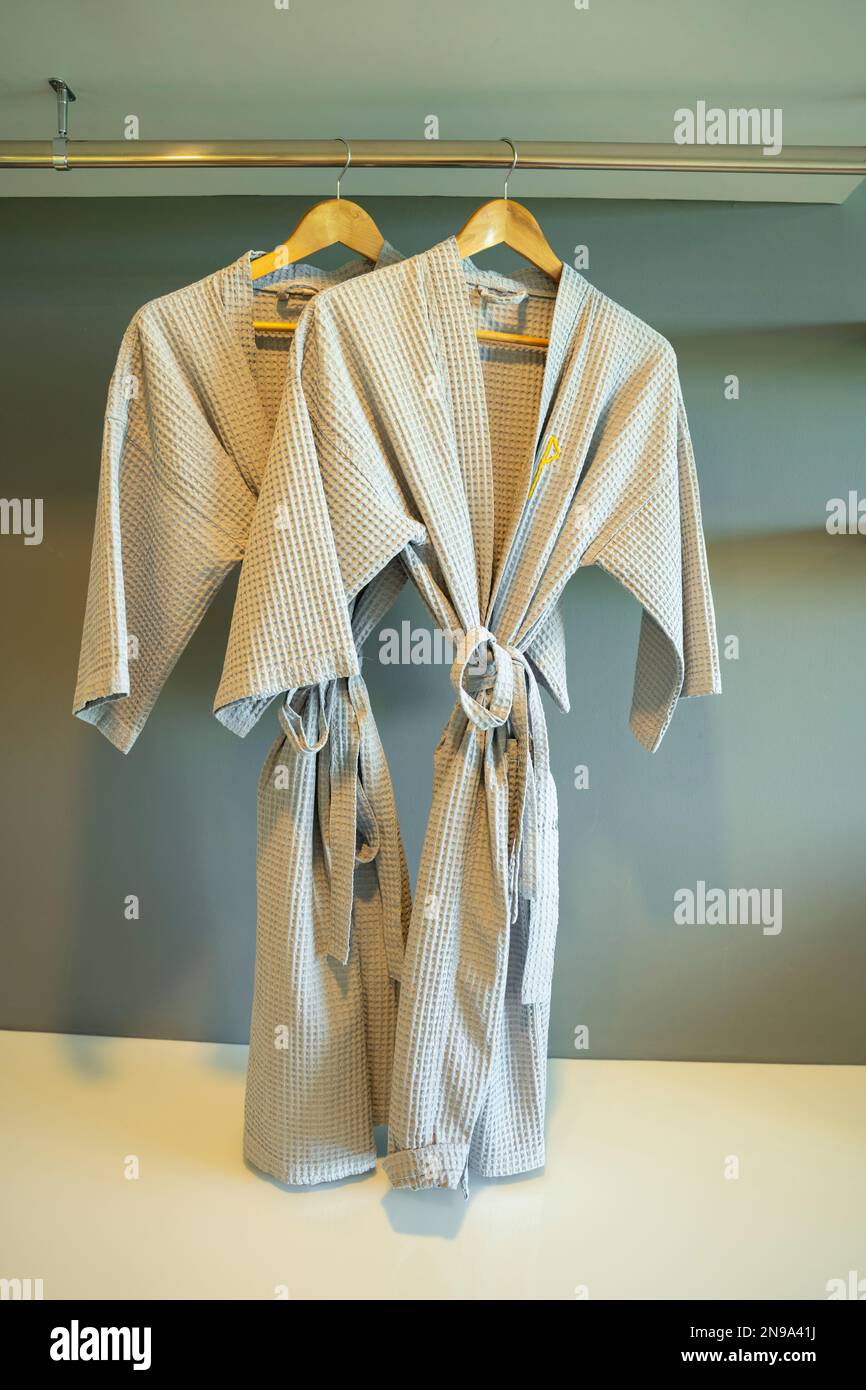 Bathrobe hanging in bathroom hi-res stock photography and images - Alamy