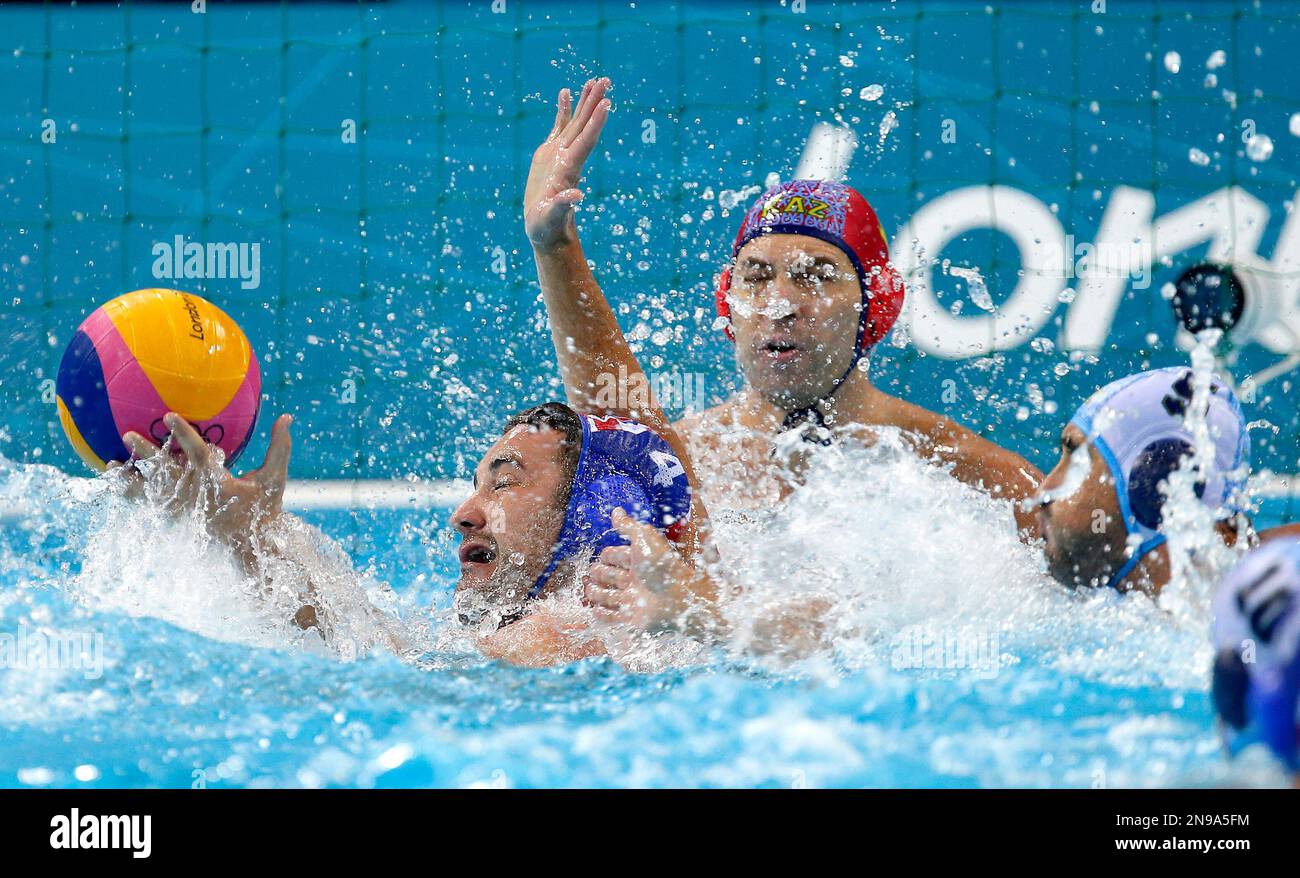 Niksa Dobud, left, of Croatia swims against Kazakhstan's Alexey Panfili ... Niksa Dobud, left, of Croatia swims against Kazakhstan's Alexey Panfili ...