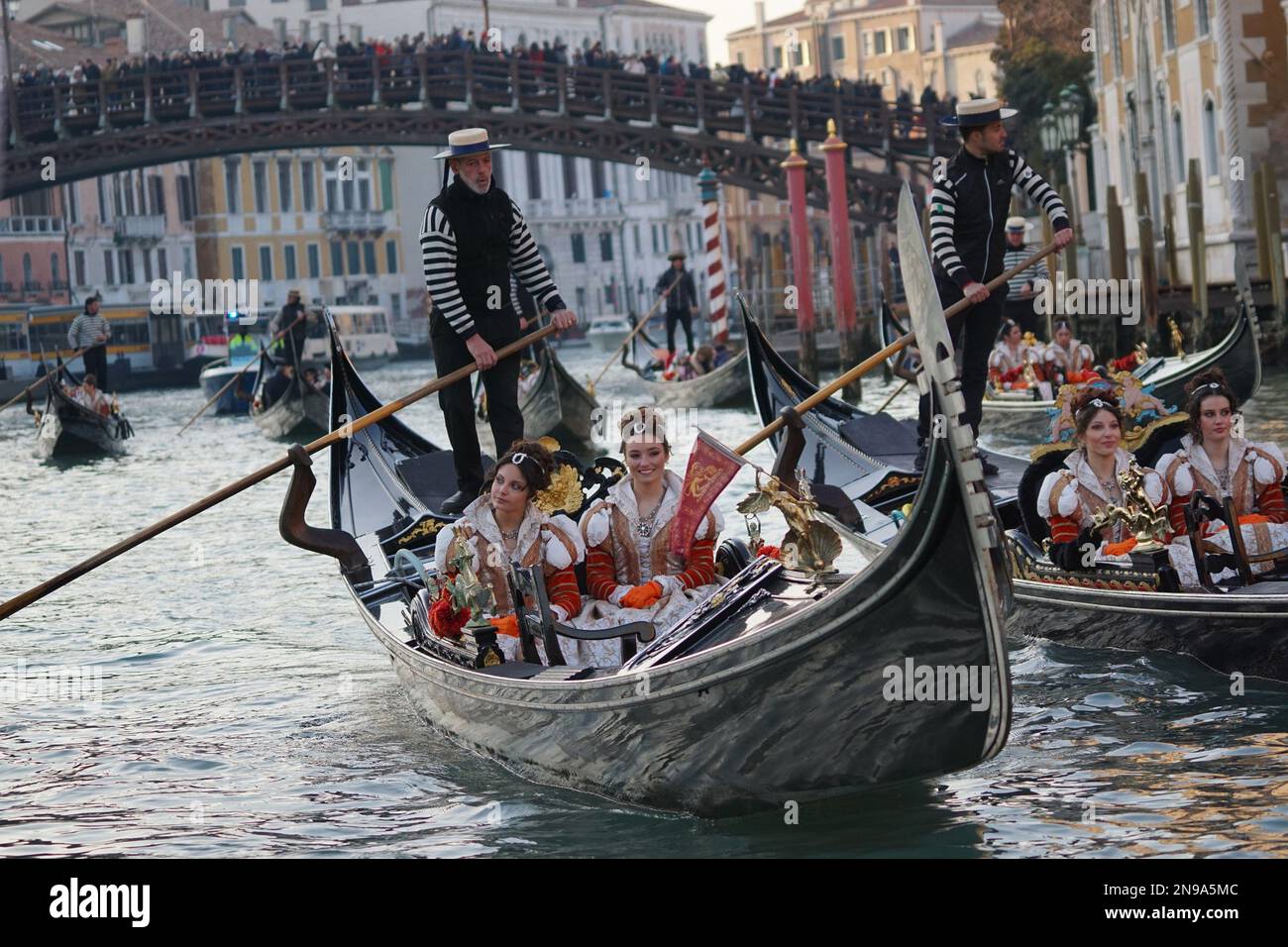 Venice, Italy. 11th Feb, 2023. Four young Venetian women, dressed in ...