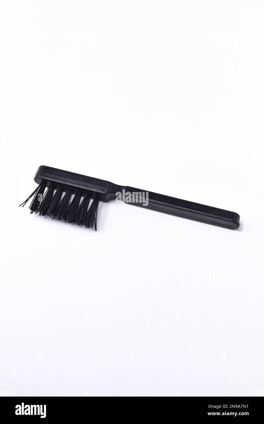 Small cleaning brush isolated on white background. To clean between the ...